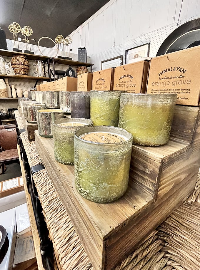 Handcrafted candles arranged like a fragrant library. Each glass vessel contains not just wax, but the promise of ambiance for countless evenings.