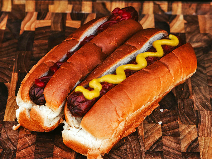 Hot dogs dressed in their Sunday best—with mustard applied in that perfect zigzag that somehow makes everything taste better.