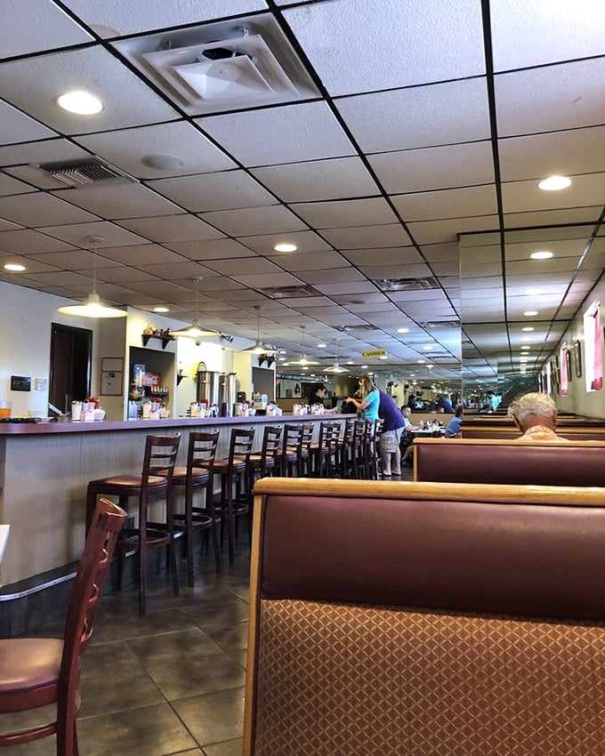 The dining room stretches out like a breakfast kingdom, with each booth a potential throne for hungry patrons seeking morning glory.