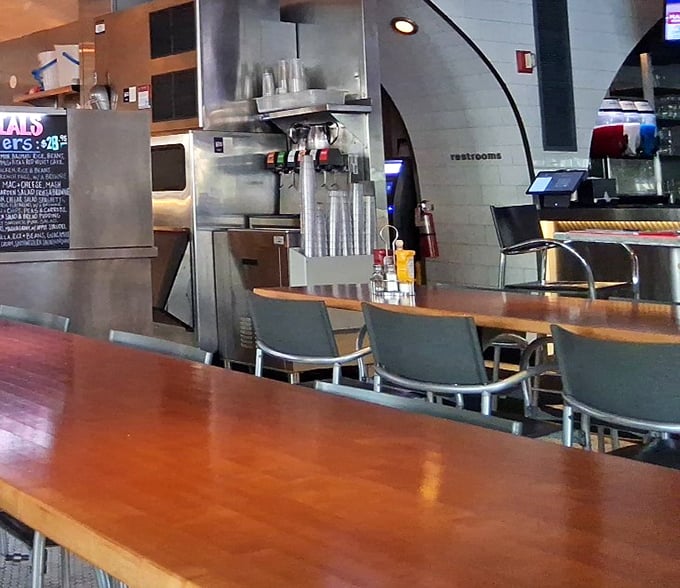 Counter seating that invites solo diners to enjoy the show—part restaurant, part theater, all entertainment with a side of excellent people-watching.