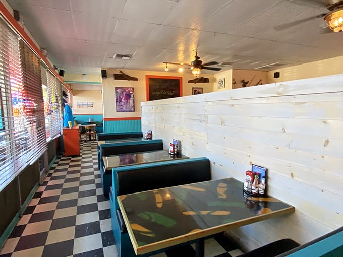 Those turquoise booths against the checkerboard floor create the perfect backdrop for seafood stories and second helpings.