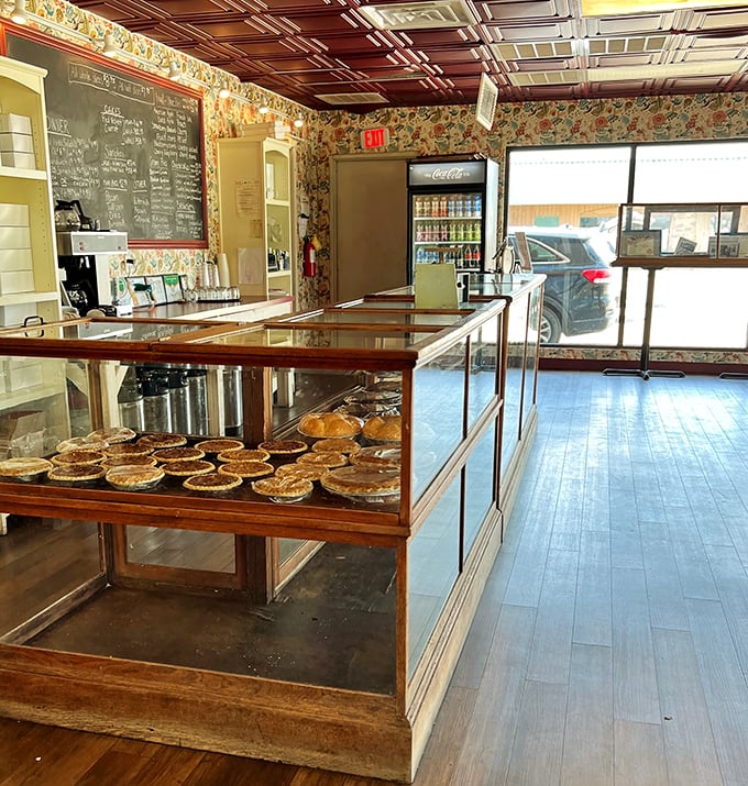 The pie sanctuary – where glass cases protect treasured creations until the moment they're chosen, like delicious contestants on a very tasty dating show.