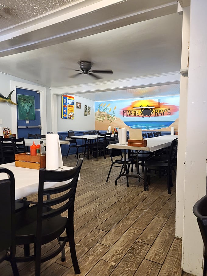 Another dining room where coastal murals remind you exactly where your dinner was swimming earlier. The painted sunset is almost as good as the real thing.