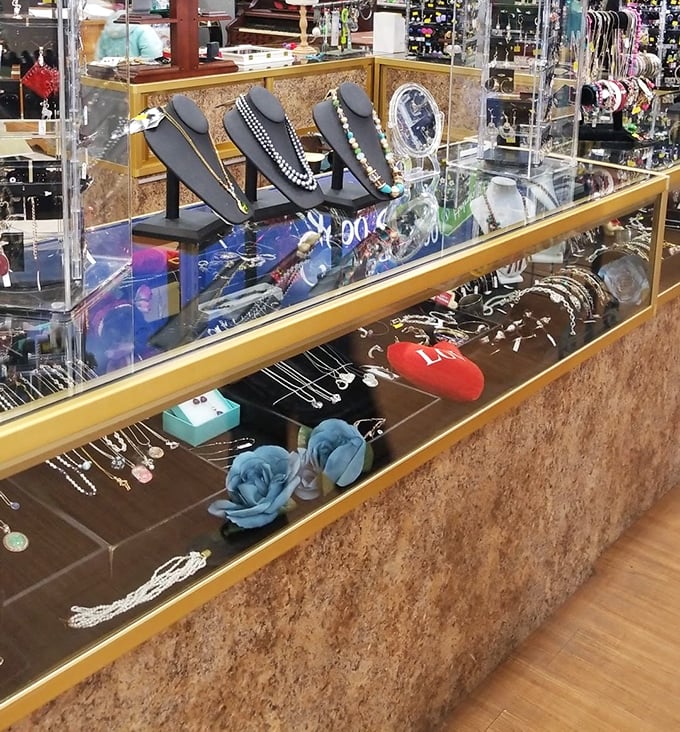 The jewelry counter gleams with possibility – someone's forgotten accessories becoming another's statement piece.