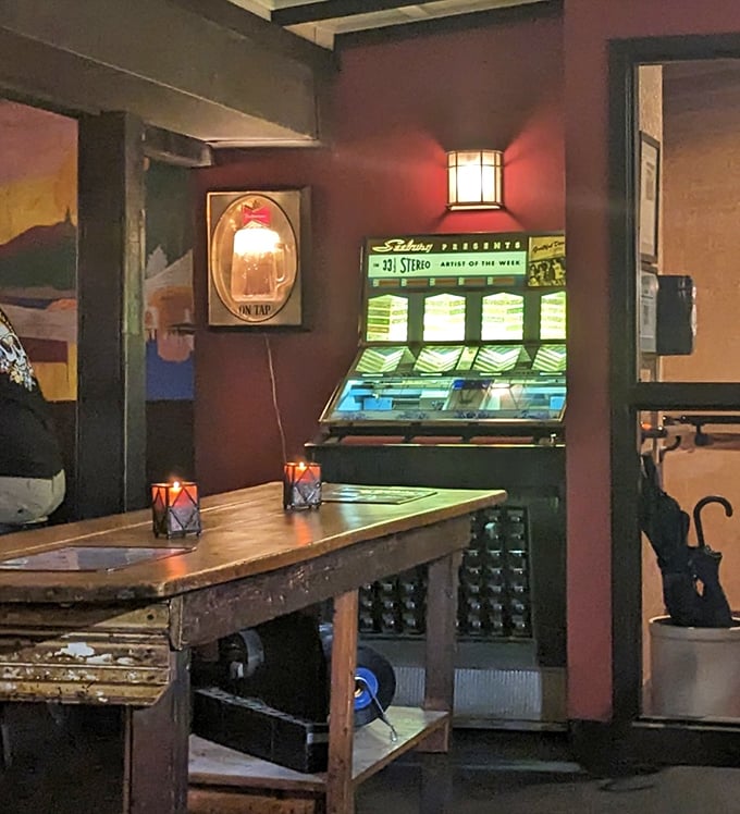 A vintage jukebox glows in the corner like a time machine, ready to transport diners to another era between bites of exceptional food.