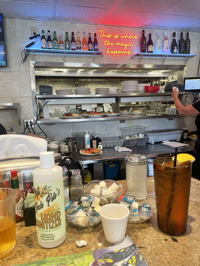 "This is where the magic happens" isn't just a neon sign – it's the absolute truth about this bustling kitchen.