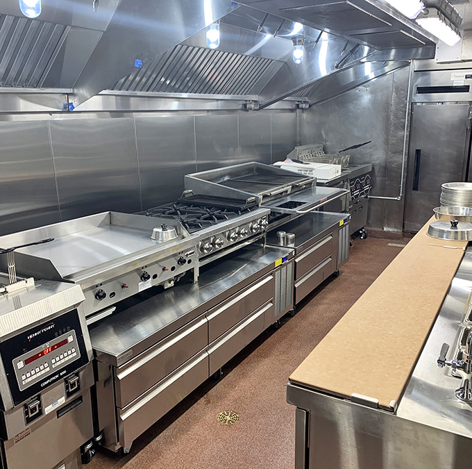 The gleaming kitchen – command center for culinary magic. Stainless steel battlestations where comfort food dreams become reality.