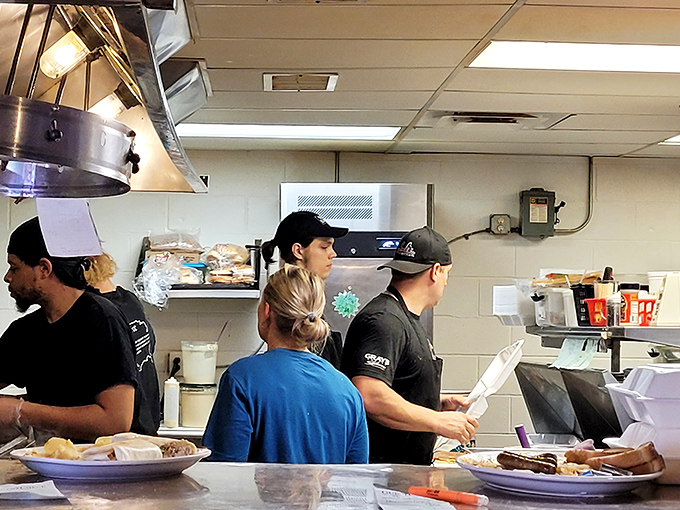 The kitchen ballet—where spatulas fly and orders materialize. These culinary choreographers turn breakfast chaos into morning masterpieces.