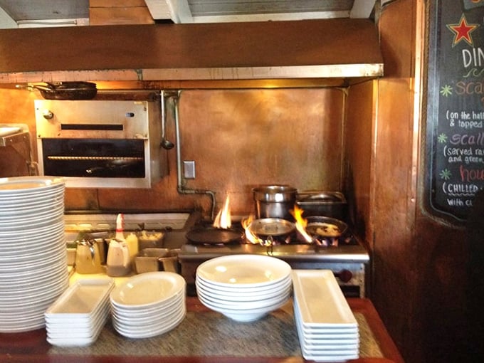 Behind the scenes, flames dance in the kitchen – where seafood magic happens before making its grand entrance to your table.