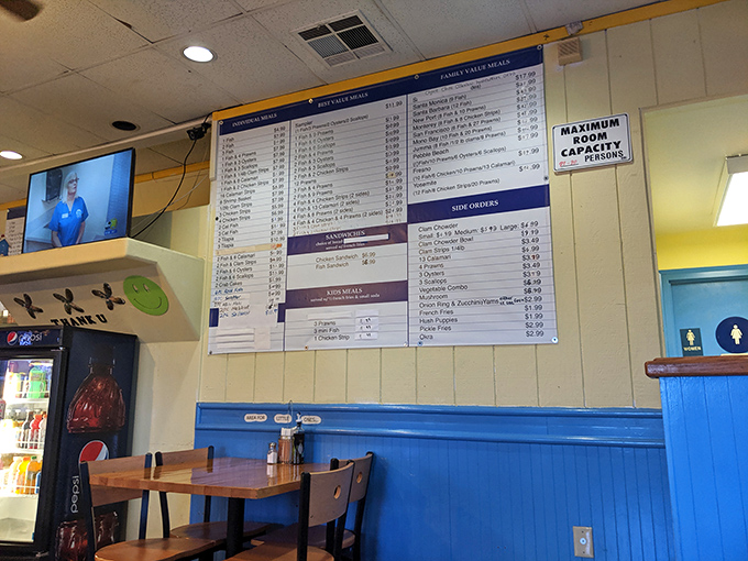 The wall menu board – a roadmap to happiness that locals have memorized but still study with the reverence of an ancient text.