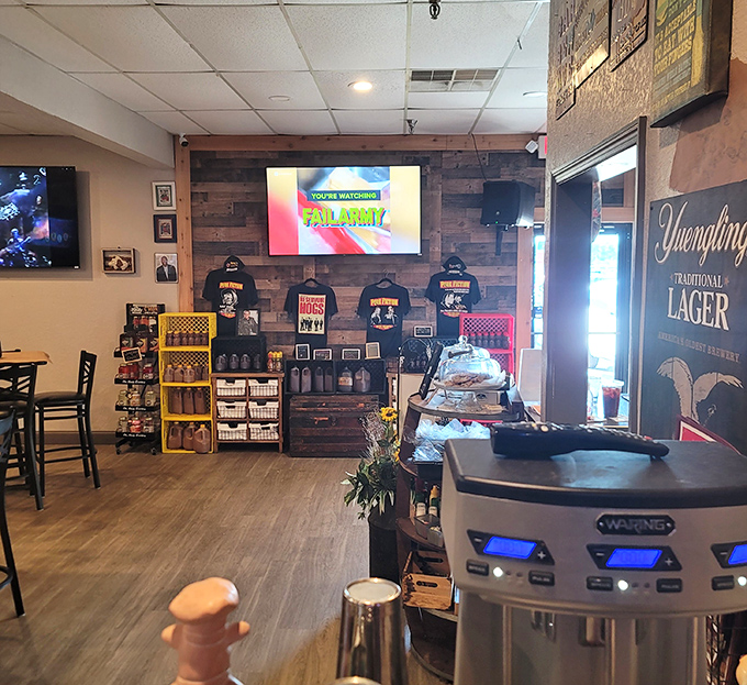 The merch wall proves you're in a place that takes its BBQ seriously enough to put it on a t-shirt. Souvenirs that smell better than postcards.