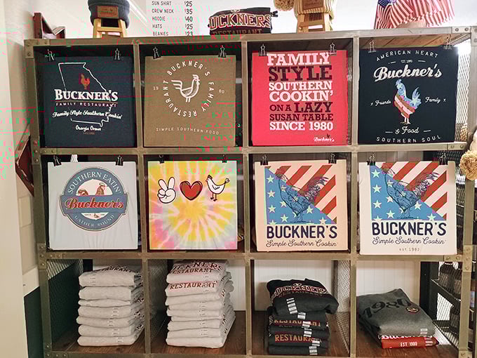 The merch wall—because sometimes you need a t-shirt to prove you survived the delicious assault on your belt that is Buckner's Family Restaurant.