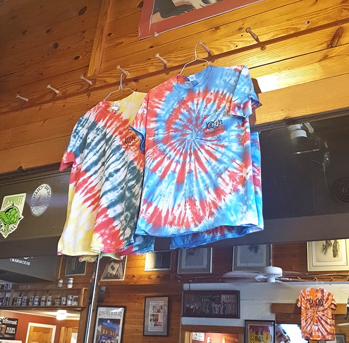 Tie-dye t-shirts hanging like psychedelic flags – because nothing says "established eatery" like merchandise that screams "eternal college spirit."