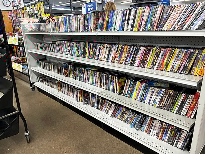 The DVD section—where physical media refuses to die and $1.99 gets you a movie night without subscription fees or spotty streaming.