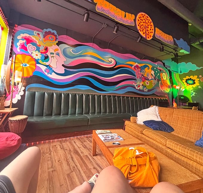 That mural isn't just decoration—it's a statement of intent. Pizza as art, dining as experience, walls as canvas. The 60s never left; they just got tastier.