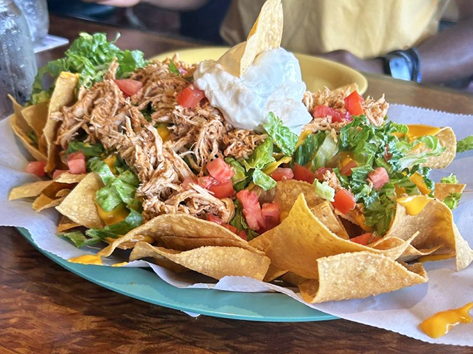These aren't just nachos—they're a fiesta on a plate where pulled meat, fresh veggies, and melted cheese throw the ultimate flavor party.