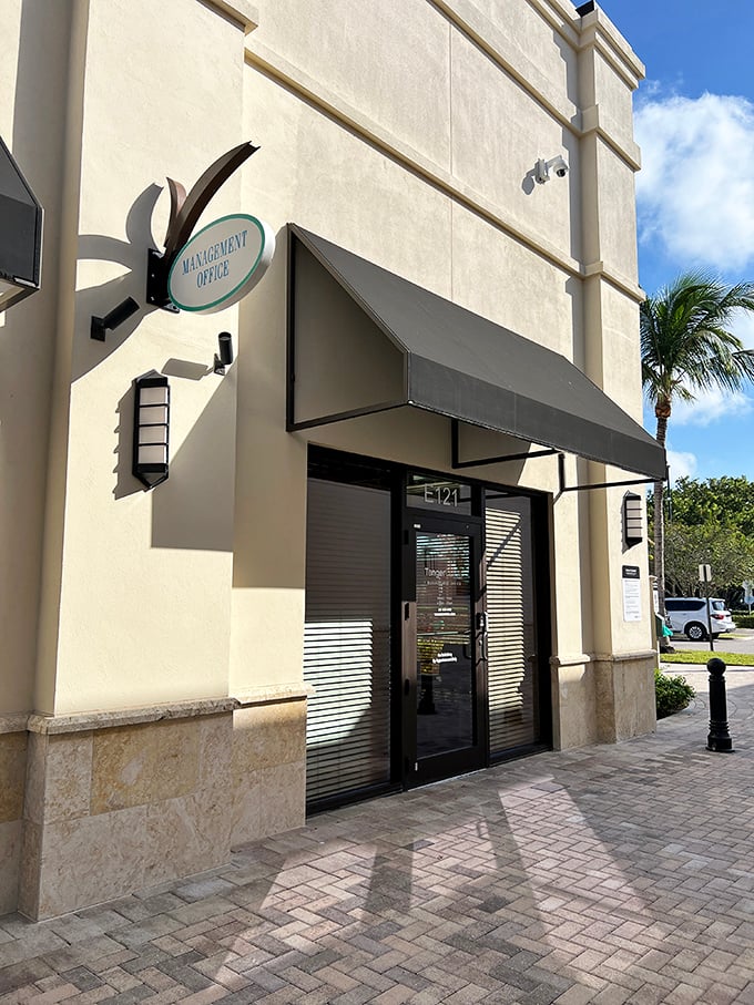 Even the management office maintains the resort-like aesthetic—because administering retail therapy should look as good as it feels.