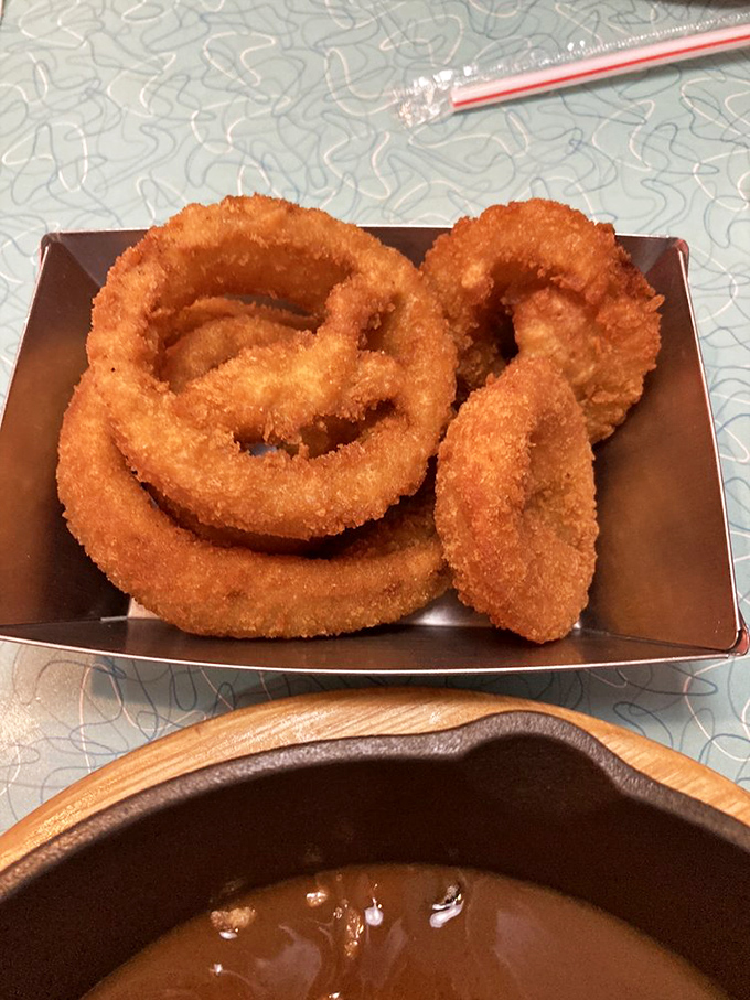 Onion rings with the structural integrity to stand at attention—crispy, golden hoops that make the perfect prelude to whatever main event follows.