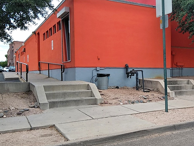 The building's accessibility ramp welcomes all fashion enthusiasts—style hunting should never have barriers.