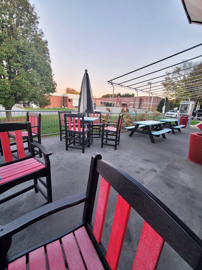 Outdoor seating for when you need fresh air with your fresh fries. Those red chairs pop against the concrete like exclamation points.