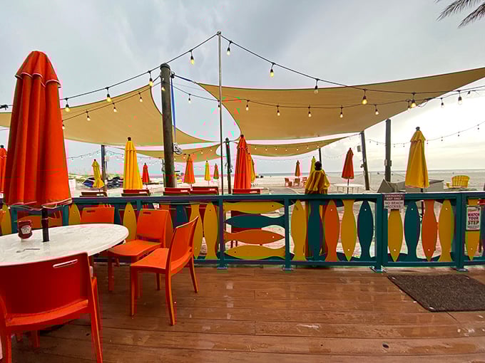 The outdoor dining deck offers front-row seats to nature's daily performance—Gulf waters by day, spectacular sunsets by evening, and string lights adding magic after dark.