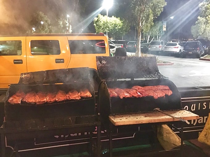 Ribs getting the star treatment they deserve—slow-cooked to perfection on outdoor smokers that perfume the air with promises of meat that surrenders from the bone.