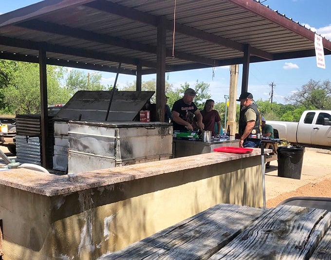 The outdoor grill station – where smoke signals of deliciousness rise from a setup that's not fancy but gets the job done spectacularly.