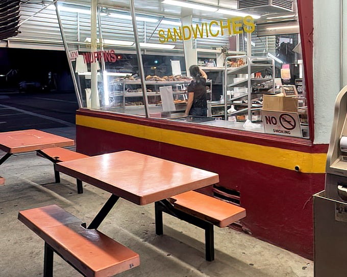 The outdoor seating area—simple, utilitarian, and perfect for that moment when you just can't wait to get home before biting into your prize.