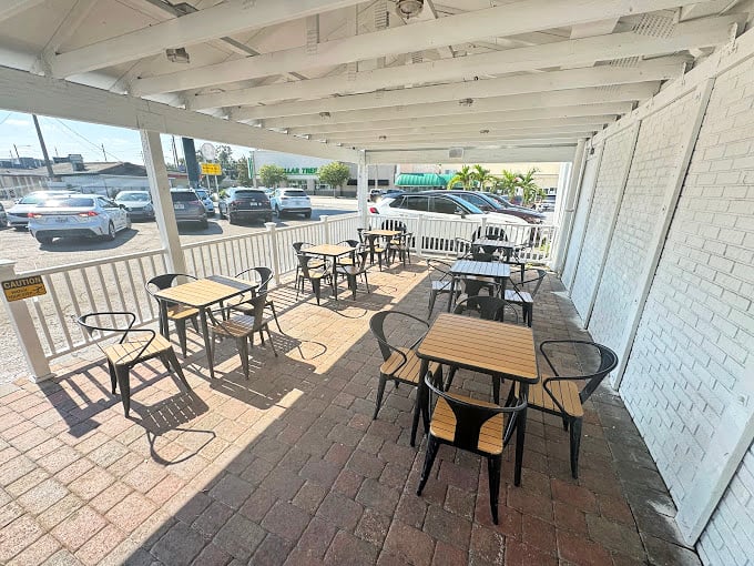 The covered patio offers a perfect spot for enjoying your haul while watching Orlando life unfold—simple pleasures at their finest.