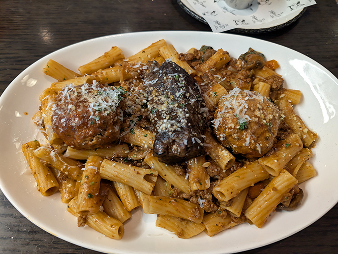 Pasta that doesn't just sit on the plate—it performs. These rigatoni with meatballs have more star quality than most Hollywood blockbusters. 