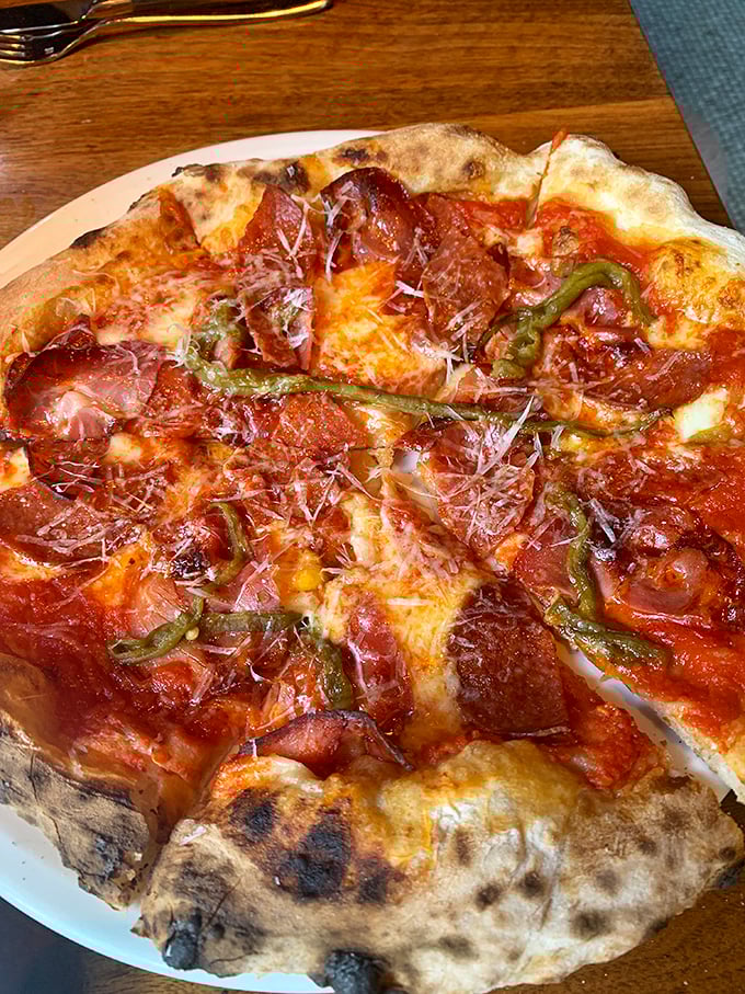 This isn't just pizza – it's a thin-crust canvas where pepperoni, green peppers and cheese create a symphony of flavors that sings.