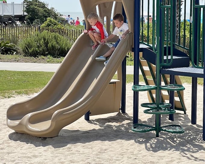 Double the fun on parallel slides. These kids are experiencing what philosophers call "the present moment"—something adults pay meditation apps to rediscover.