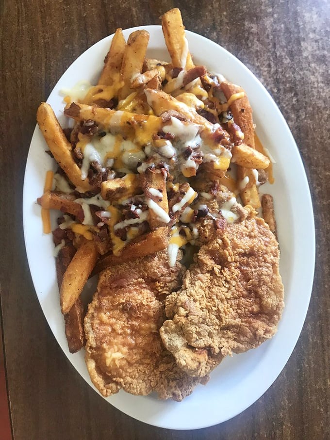 The legendary pork chop with loaded fries—a plate that's launched a thousand road trips and inspired countless "you've got to try this" conversations.