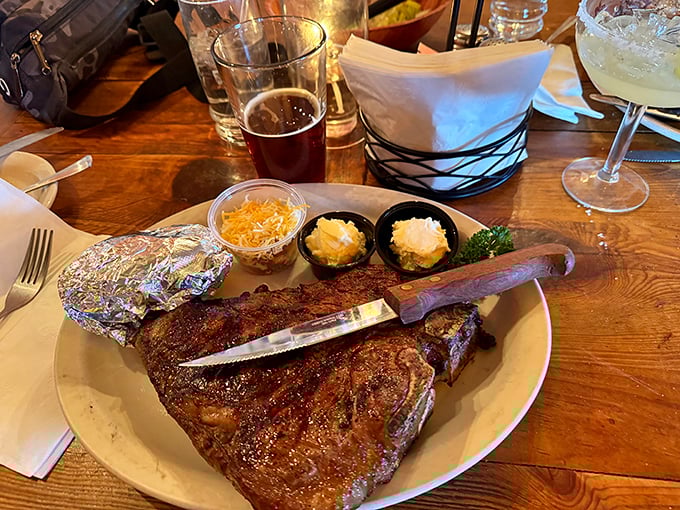 A steak knife standing at attention—ready for the task at hand. This impressive cut with all the fixings is Arizona dining at its most authentic.