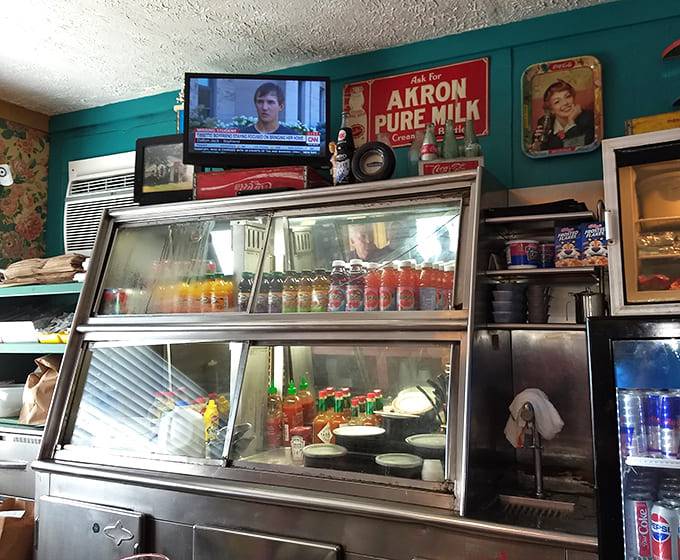 Behind the counter, where the magic happens – no molecular gastronomy, just decades of know-how and well-seasoned equipment.