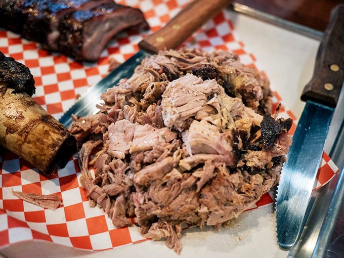 Pulled pork in its natural habitat—tender, juicy, and ready for its close-up. Each strand tells the story of hours in the smoker.