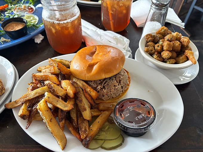 Bennett's BBQ sandwich doesn't need fancy presentation—just plenty of napkins. Tender pulled pork on a soft bun with crispy fries is Southern poetry on a plate.