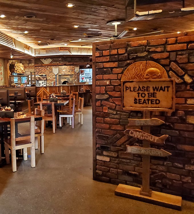 The brick-lined entrance sets the stage for the smoky drama about to unfold on your plate—anticipation never tasted so good.