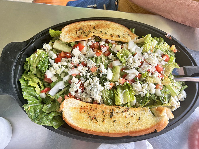 This isn't just a salad—it's a proper meal that happens to include lettuce, with garlic bread standing guard to ensure you don't leave hungry.