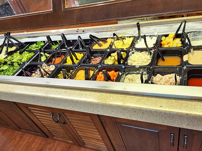 The salad bar—a colorful array of fresh ingredients standing at attention, ready to march onto your plate in perfect formation.