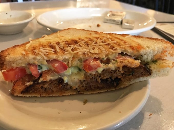Not just a sandwich but an architectural marvel—layers of savory filling and melted cheese creating the perfect handheld masterpiece.