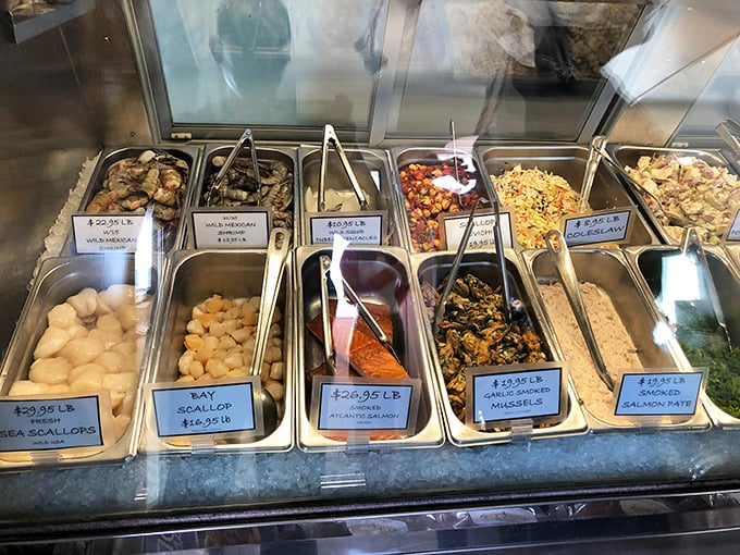 The seafood case – a treasure chest of oceanic delights where tomorrow's dinner waits for those wise enough to cook at home.