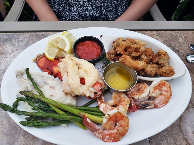 A seafood platter that makes you feel like you've won the lottery—lobster, shrimp, and asparagus creating a maritime celebration on your plate.
