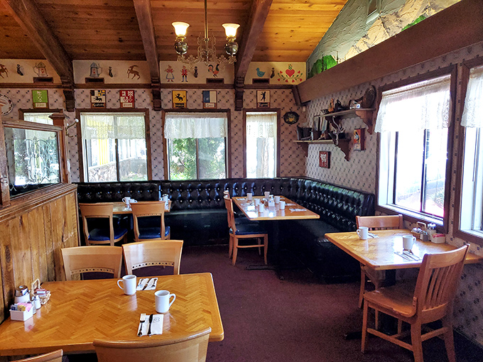 That corner booth with its black leather banquette—the breakfast equivalent of VIP seating where pancake dreams come true.