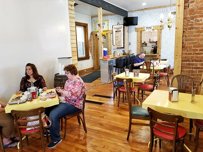 Simple tables, wooden floors, and brick walls create the perfect stage for the real star—the food. No distractions, just pure BBQ focus. 