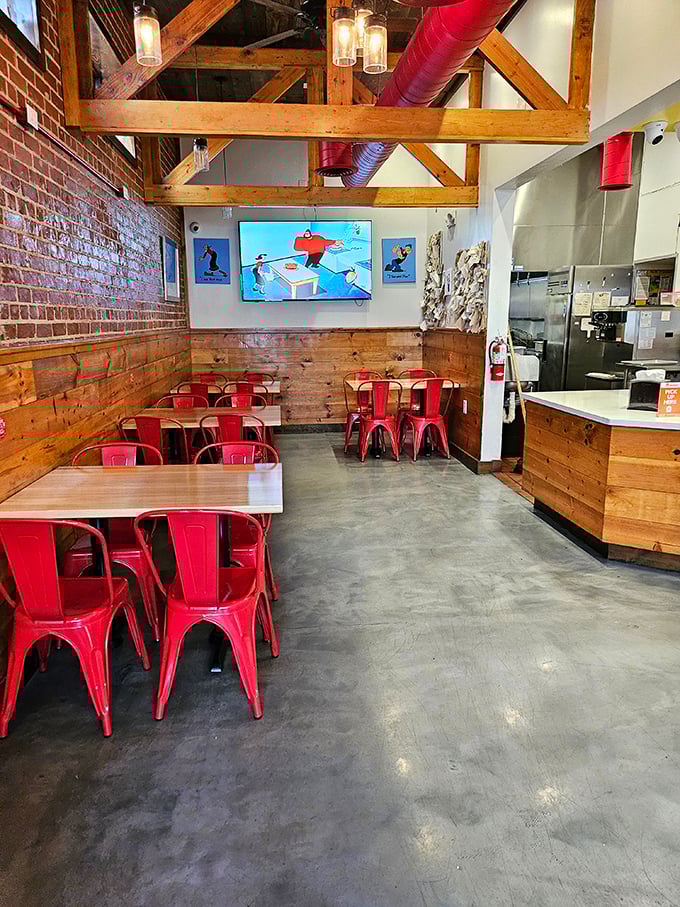 Red chairs against wooden walls create the perfect setting for the serious business of enjoying food that demands your full attention.