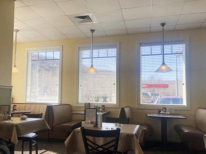 Sunlight streams through windows onto comfortable booths – nature's way of highlighting where your next food memory is about to be made.