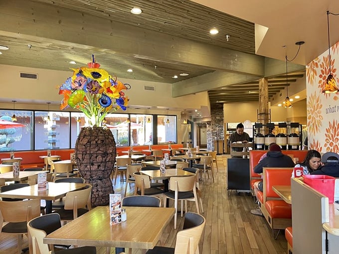 The interior's thoughtful design balances earthy elements with pops of color—like the desert itself after a spring rain. That glass sculpture demands attention.