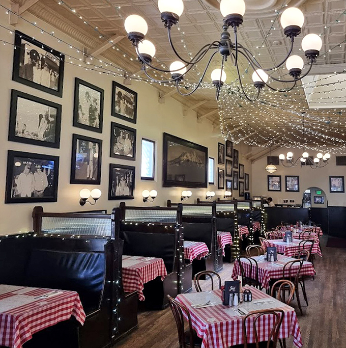 Black and white photos tell stories on the walls while string lights create a perpetual celebration. History meets hospitality in every corner.