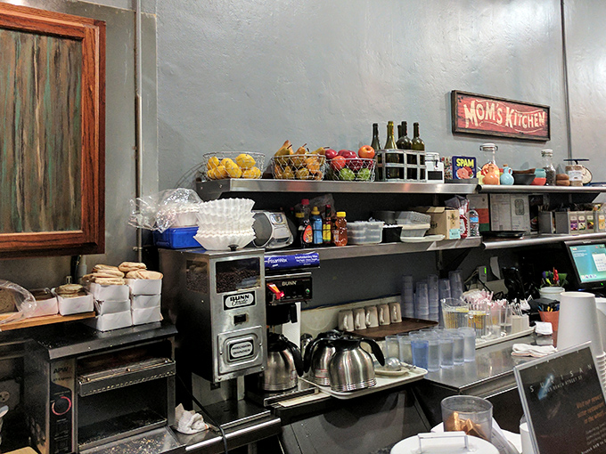 Fresh fruit baskets and coffee carafes stand ready for service—the building blocks of happiness arranged on stainless steel shelves.